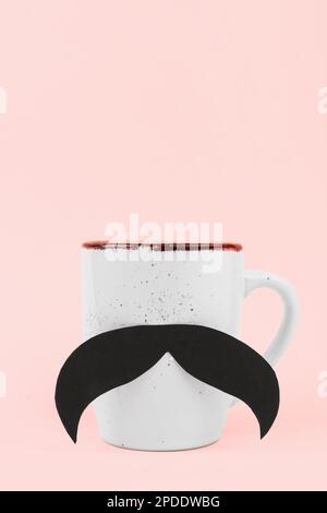 Ceramic cup with paper mustache on pink background Stock Photo - Alamy