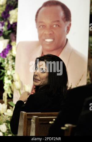 Nina Rawls, widow of singer Lou Rawls, holds her young son Aiden as ...