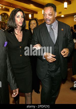 Nina Rawls, widow of singer Lou Rawls, holds her young son Aiden as ...