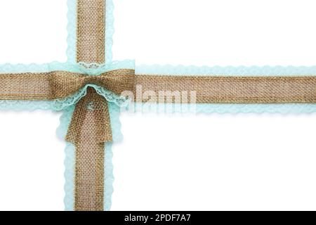 Burlap ribbons and bow with light blue lace on white background, top ...