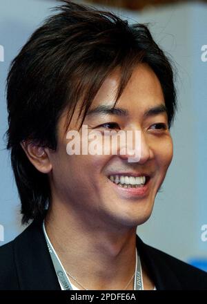 Hong Kong actor and singer Ekin Cheng waves during a premiere for the ...