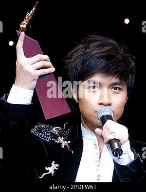 Hong Kong Leo Koo holds the trophy after award the best Top Ten Gold ...