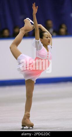Japanese teen sensation Mao Asada, 15, smiles with her coach Machiko ...