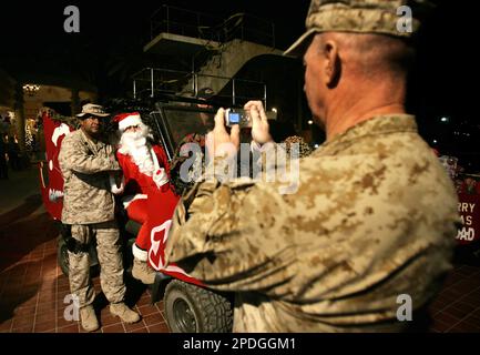 U.S. Marine Corps Master Gunnery Sgt. Jonathan R. White, right, senior ...