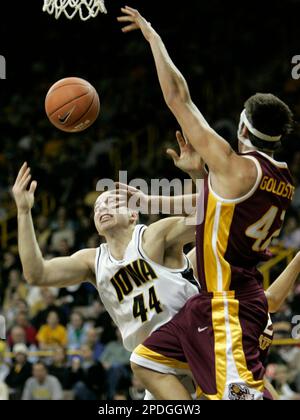Iowa's Greg Brunner, left, looks to drive around Ohio State's Matt ...
