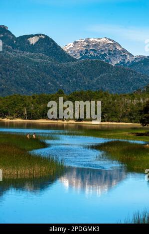 Lake Villarino with snowy peaks in the distance, as seen from the Rura ...