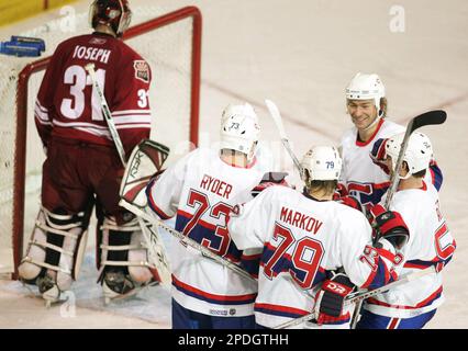 Montreal Canadiens' Pierre Dagenais, right, keeps his eye on the ...