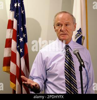 Former Massachusetts Attorney General Tom Reilly, right, reacts when ...