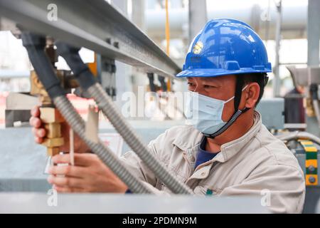 SUZHOU, CHINA - MARCH 15, 2023 - Construction workers overhaul ...