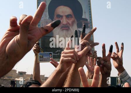 Iraqi Shiites flash victory signs, showing off their ink marked fingers ...