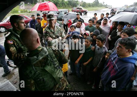 U.S. Army 1st Sgt. Marcos Morales, presents the Company's colors during ...