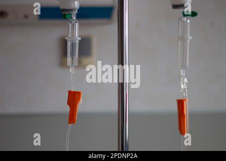 Saline saline bags hung and ready to be administered to the patient ...
