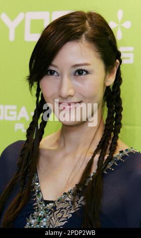 Hong Kong actress Michelle Monique Reis (R) and actor Aaron Kwok (L ...