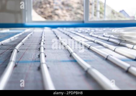 Layout of pipes for hydronic underfloor heating Stock Photo - Alamy