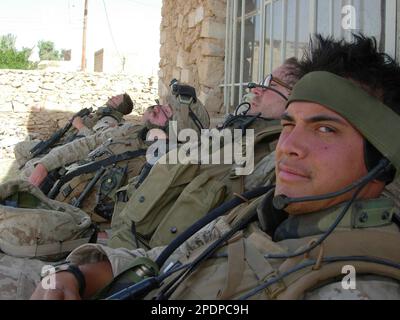 Marines from "L" Company, Third Battalion, Ninth Marine Regiment, move ...