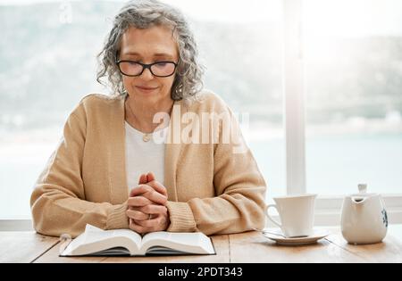 Catholic, Christian elderly woman with her bible, praying the rosary ...