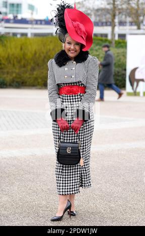 A racegoer poses for photographs on day four of Royal Ascot at Ascot ...