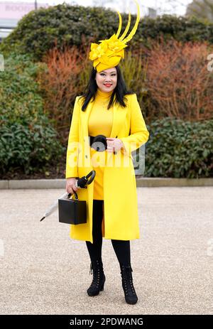 A racegoer poses for photographs on day four of Royal Ascot at Ascot ...