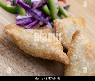 Samosa - Punjabi Samosa with salad Stock Photo - Alamy