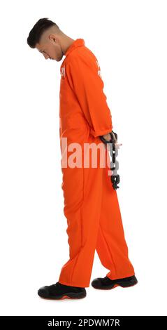 Prisoner in orange jumpsuit with chained hands on white background ...