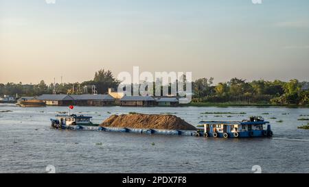 A motorised barge on the Mekong River near Long Xuyen in the Mekong ...