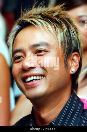 Hong Kong singer-actor Hacken Lee, second from right, poses with his ...