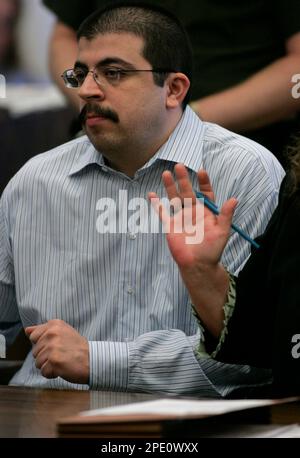 Orange County Superior Court Judge Thomas Goethals reads a portion of ...