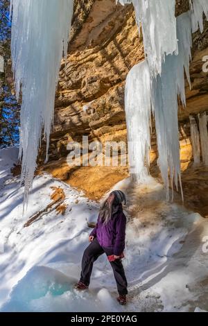 Karen Rentz at Amphitheater ice formation, with ice daggers overhead ...