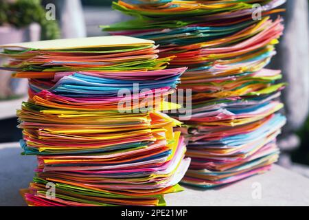 Multicolor memo notes with tasks stored chaotically in 2 stacks. Work ...