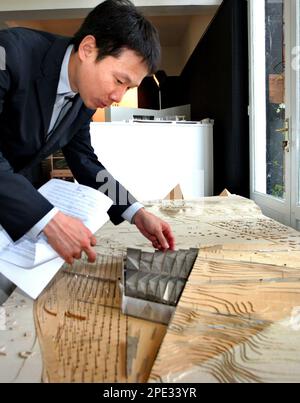 Irish Shih-Fu Peng of the Dublin firm Heneghan in front of his designs ...