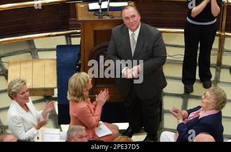 Gov. John Engler and wife Michelle pose with their triplets during a ...