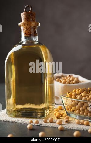 Composition with soybean oil on grey table Stock Photo - Alamy