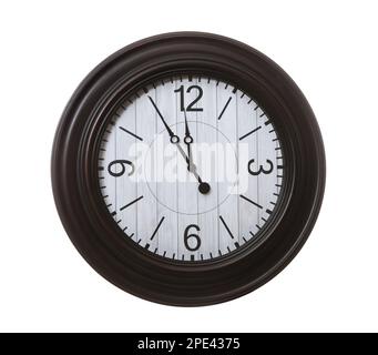 Stylish wall clock showing five minutes until midnight on turquoise ...