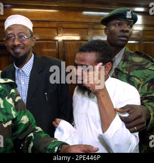 Aboud Rogo Mohammed gives a thumbs up sign from a prison van as he and ...