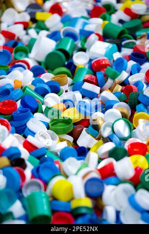 Multi-colored plastic bottle caps background Stock Photo - Alamy