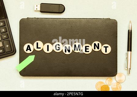 Alignment. Cubes form the word Alignment. Broad concept from business ...