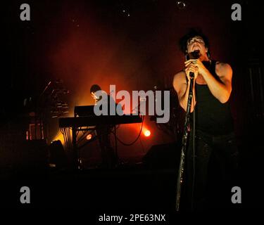 Trent Reznor, lead singer of Nine Inch Nails, performs covered in mud ...