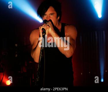 Trent Reznor, lead singer of Nine Inch Nails, performs covered in mud ...