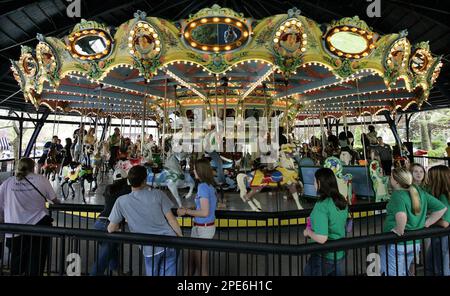 The 1926 wooden carousel at Kennywood Park in West Mifflin, Pa., twirls ...