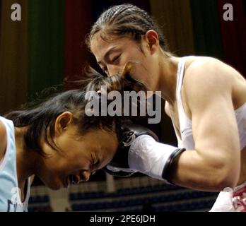 South Korean Champion Kim Ju-hee, right, fights with Japanese ...