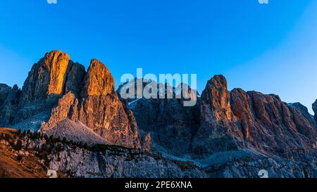 Sella massif in evening light with moon Stock Photo - Alamy
