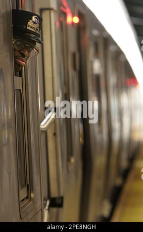 subway conductor in train car Stock Photo - Alamy