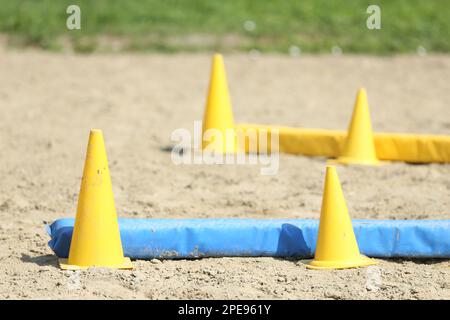 Obstacles and buoys in the sand in an empty equestrian center Stock ...