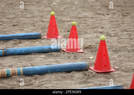 Obstacles and buoys in the sand in an empty equestrian center Stock ...