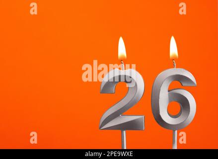 Candle number 26 - Birthday in blues foamy background Stock Photo - Alamy
