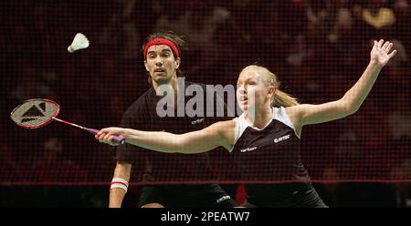 England's Gail Emms plays a return as Nathan Robertson looks on during ...