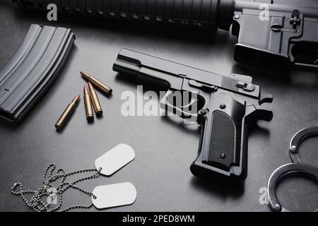 Composition with gun and bullets on stone table, flat lay Stock Photo ...