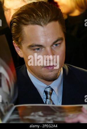 U.S actor Leonardo DiCaprio signs autographs as he arrives at the World ...