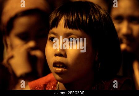 A tsunami affected Nicobari girl, from Car Nicobar, sheds tears as she ...