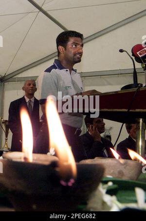 Sri Lankan cricketer Muttaiah Muralitharan, right, talks to his wife ...